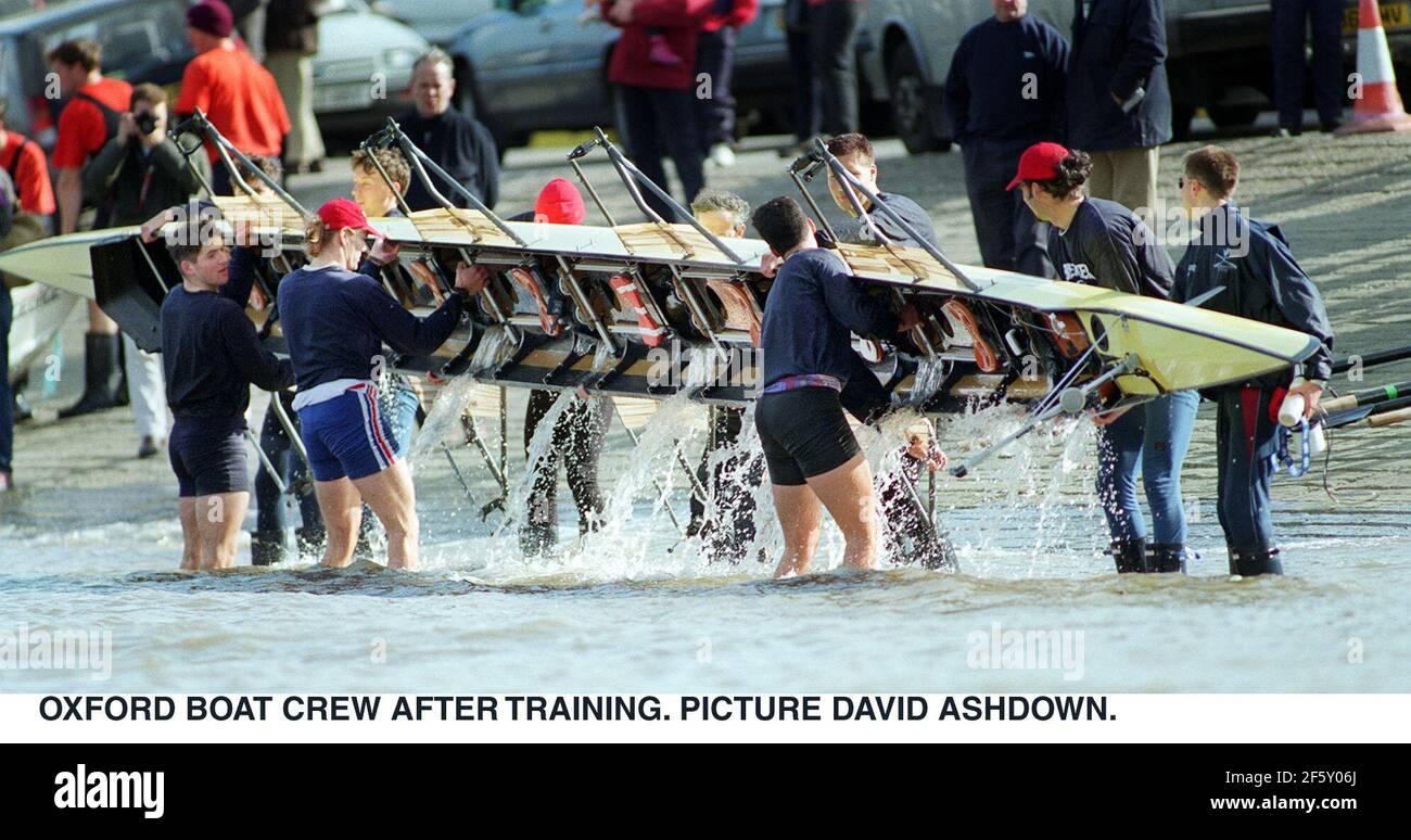 Oxford Rowing Boat Crew lift their boat out of the water after a team ...