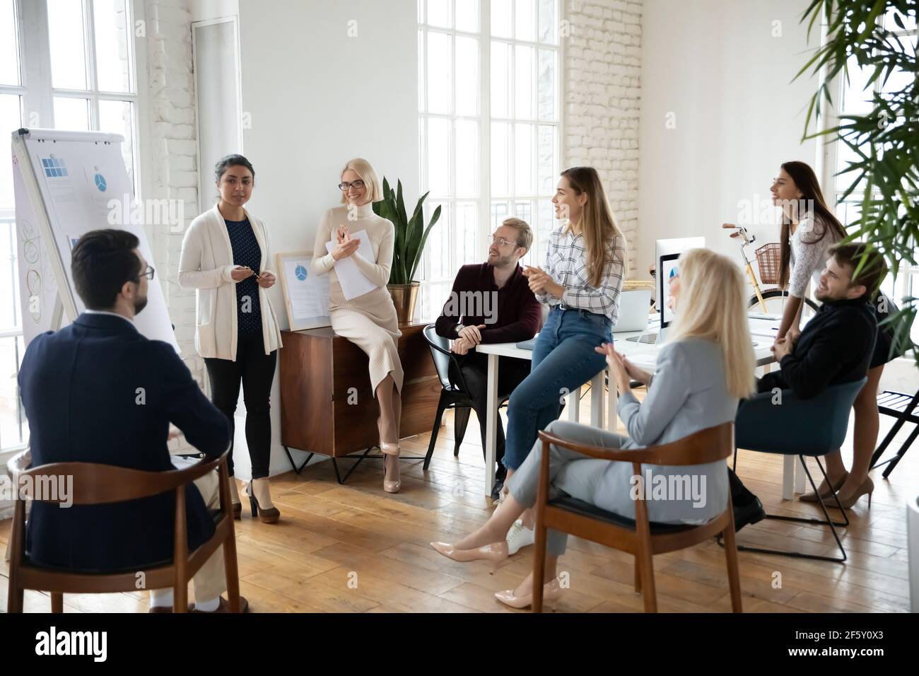 Indian female coach make whiteboard presentation for employees Stock ...