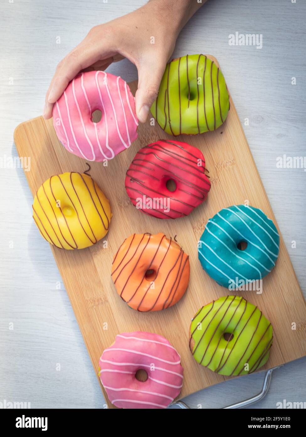 Colorful donuts with chocolate topping Stock Photo - Alamy