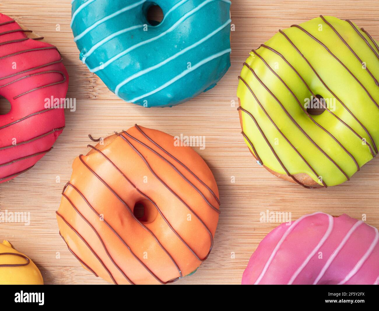 Colorful donuts with chocolate topping Stock Photo - Alamy