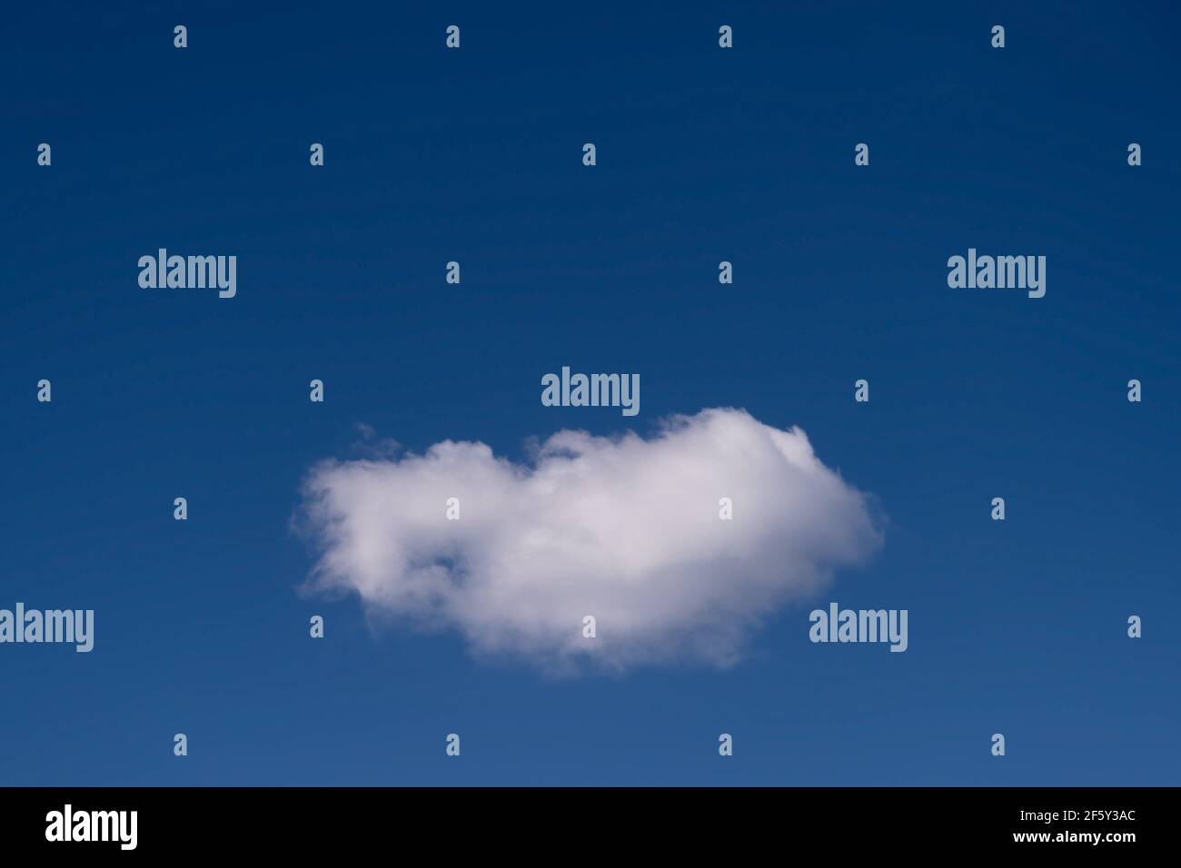 Beautiful cloudscape of nature single white cloud only one on blue sky ...