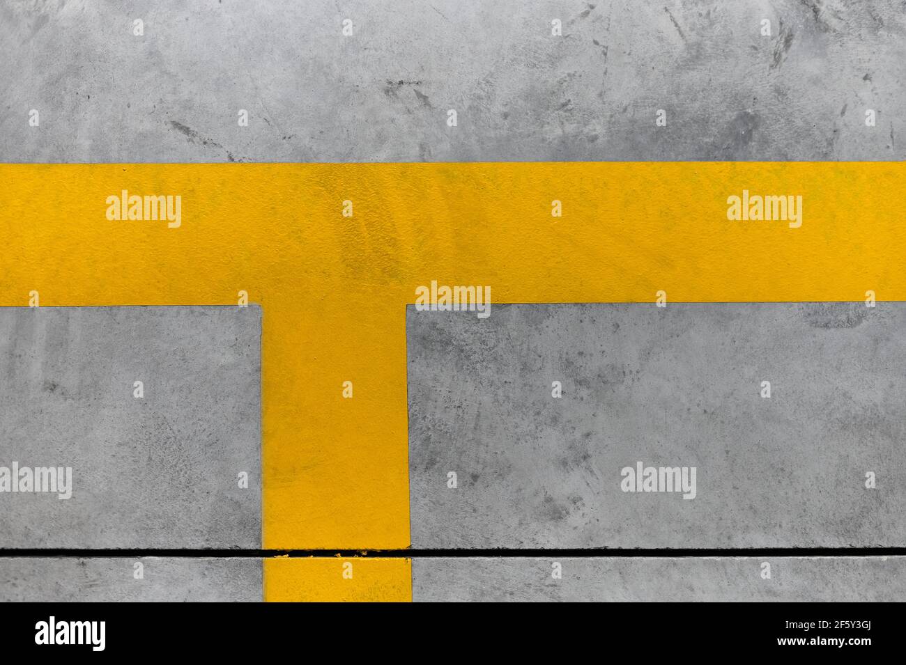 detail of yellow lines on a concrete floor delimiting a parking place ...