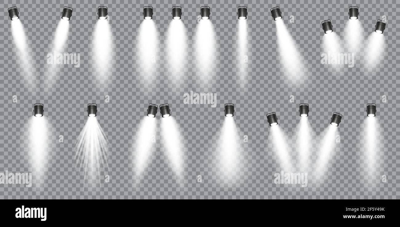 Illuminated studio spotlights collection. Bright light beam ...
