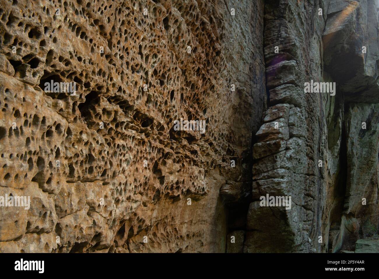 Pock Filled Cliffside in Strange Erosion Phenomenon Stock Photo - Alamy