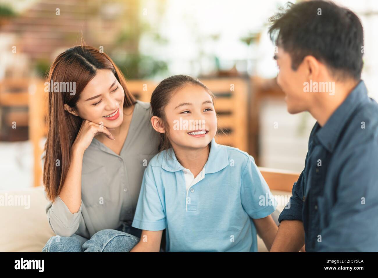 Parent having serious conversation with daughter at home Stock Photo ...
