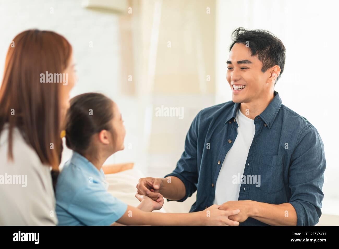 Parent having conversation with daughter at home Stock Photo - Alamy