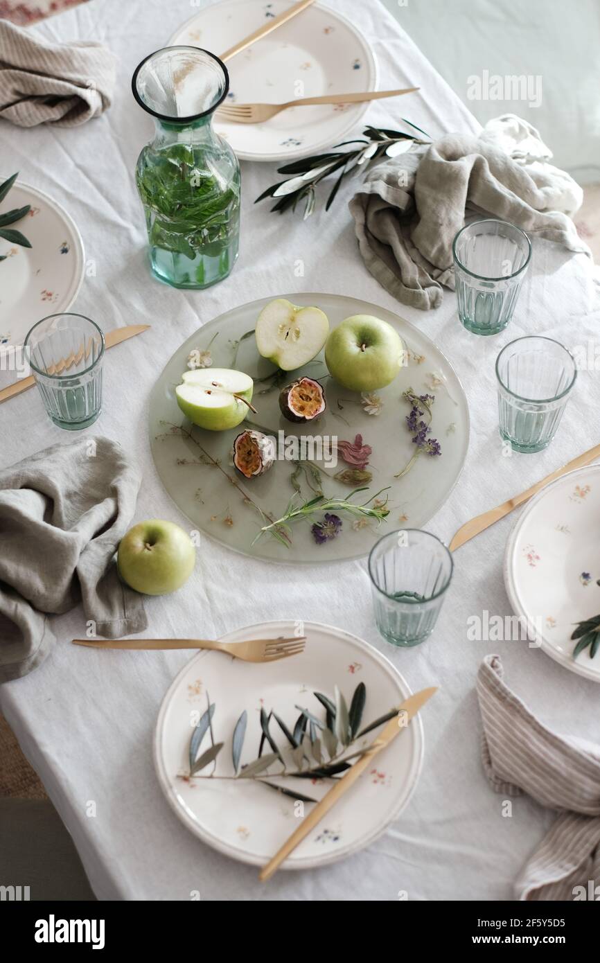 Spring light table setting with white tablecloth for family gathering ...