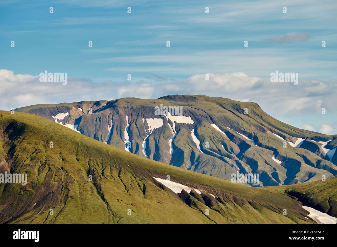Green mountains covered with snow Stock Photo - Alamy