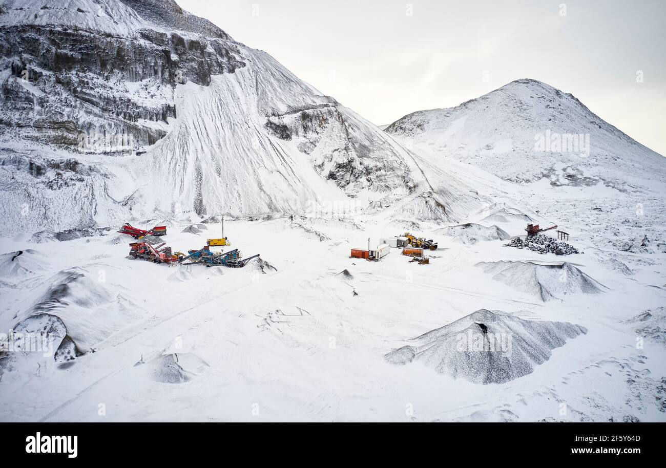 Heavy equipment on snowy remote hill Stock Photo - Alamy