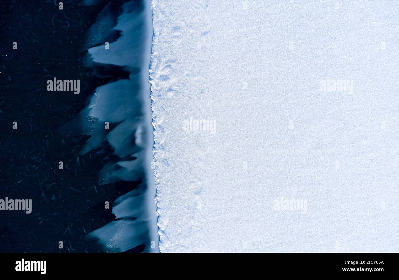 Snow covered shoreline with ice peaks Stock Photo - Alamy