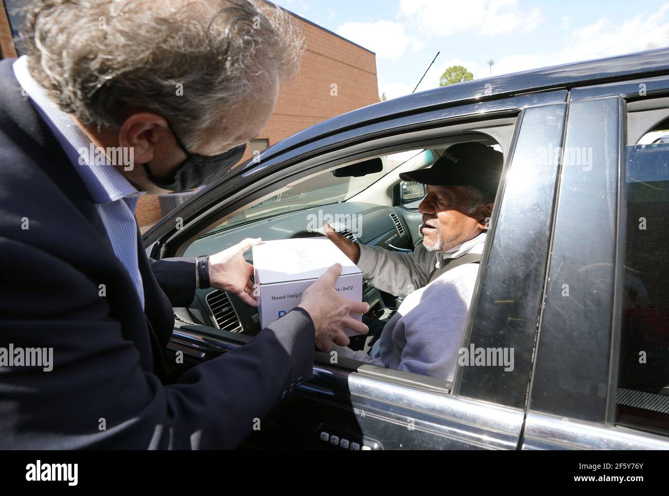 St. Louis County Executive Dr. Sam Page, gives away one of the 1,500 ...