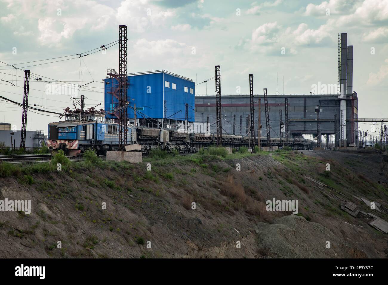 Rudny/Kazakhstan - May 14 2012: Open-pit mining iron ore. Railway train ...