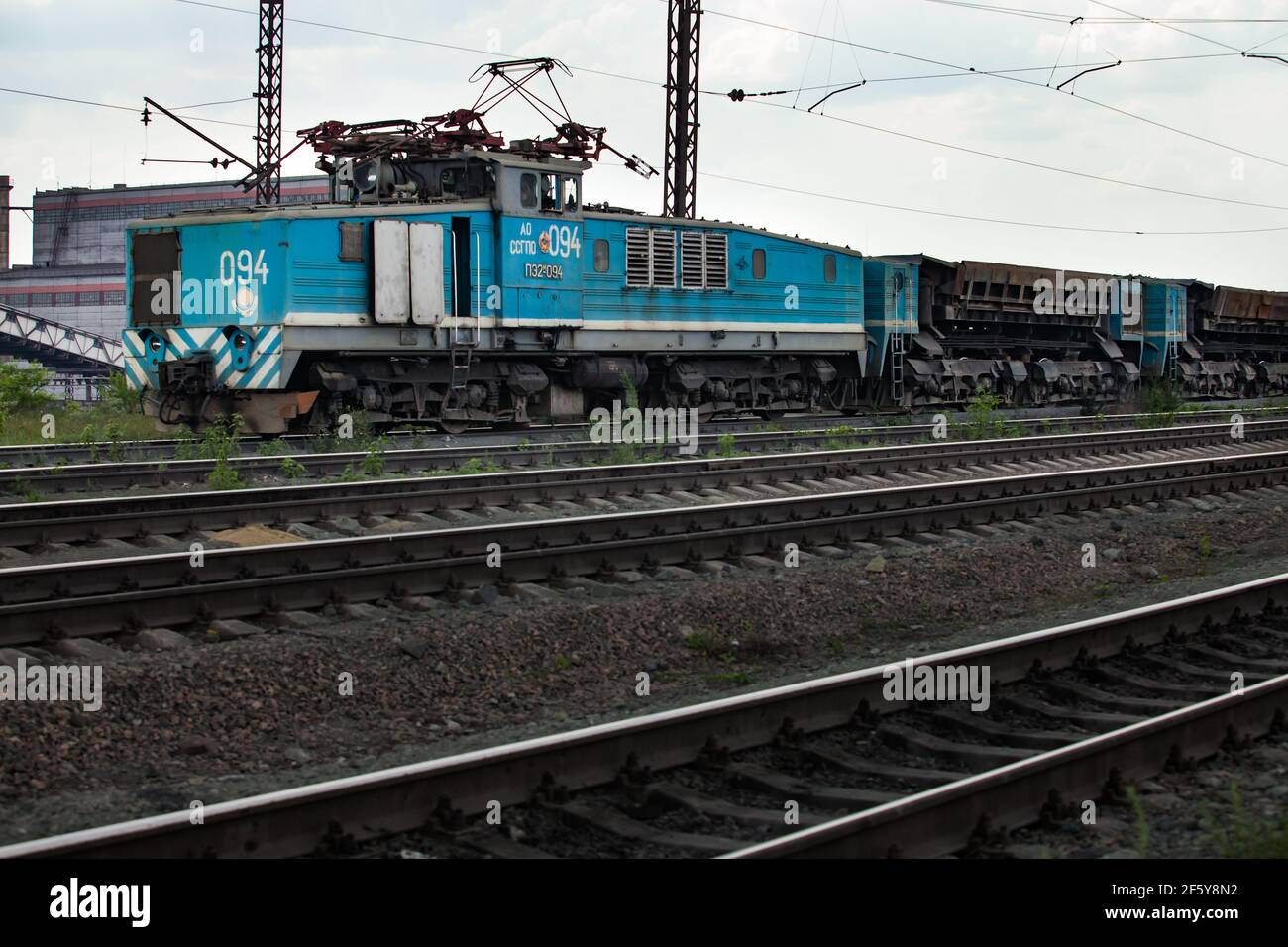 Rudny/Kazakhstan - May 14 2012: Open-pit mining iron ore. Railway train ...
