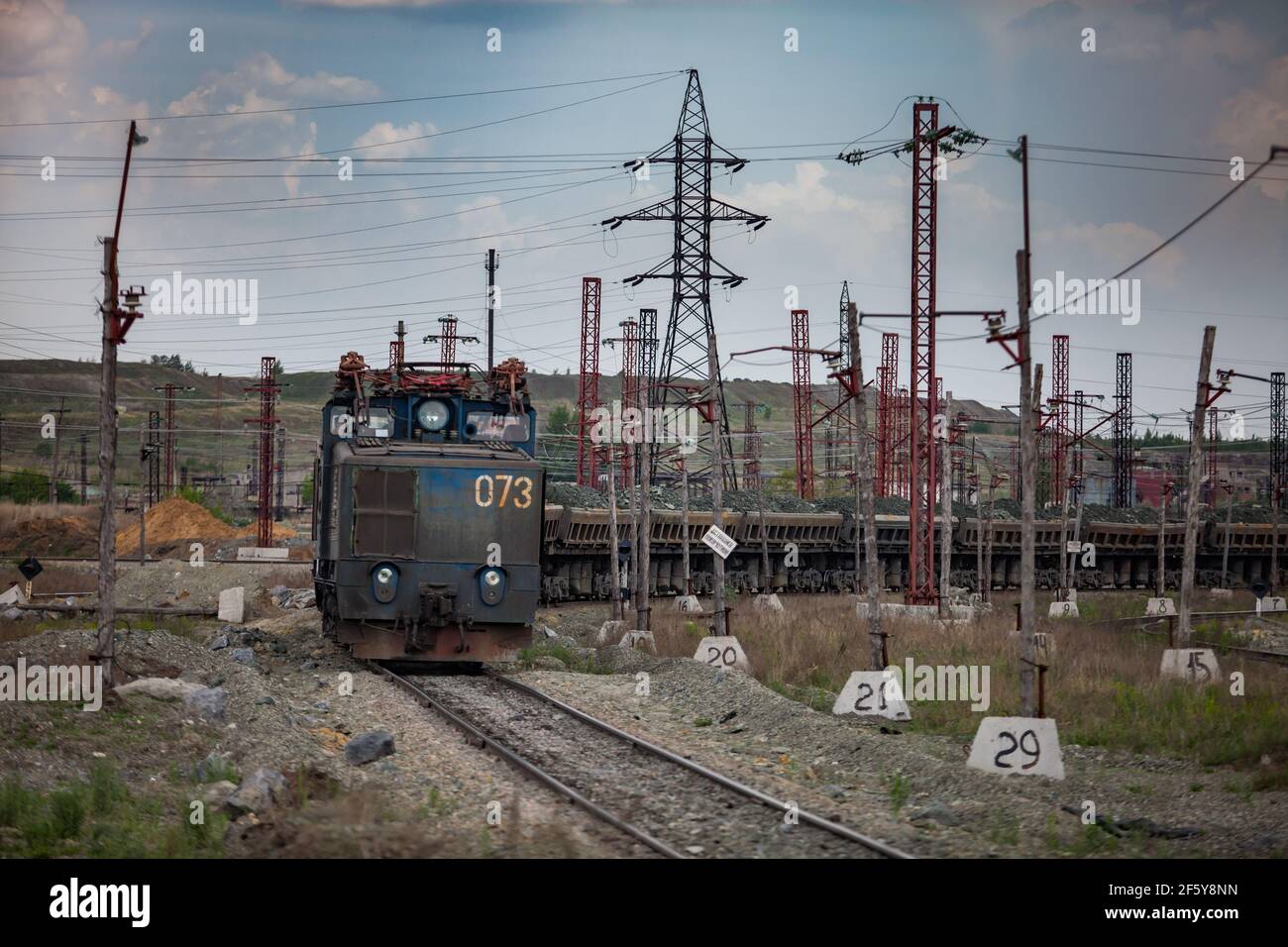Rudny,Kazakhstan - May 14 2012:Open-pit mining iron ore. Railway train ...