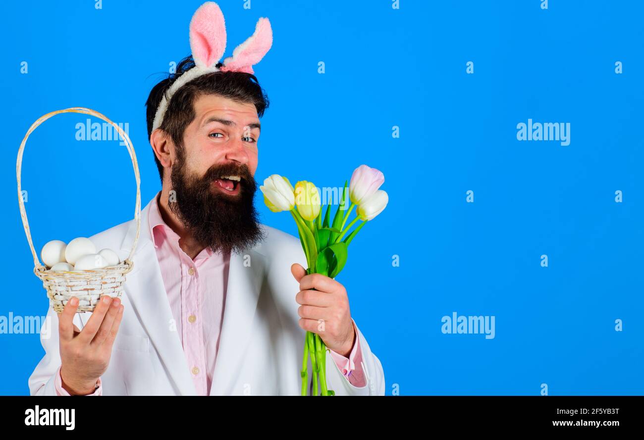 Happy Easter. Smiling business man in suit with basket egg and Spring ...
