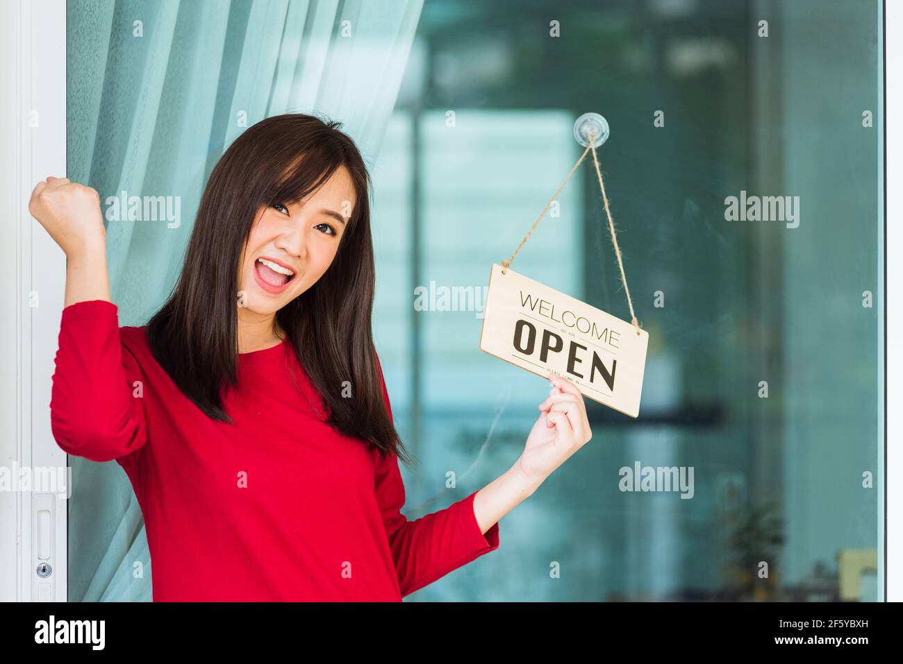 Asian young woman glad and smiling she notice sign wood board label ...