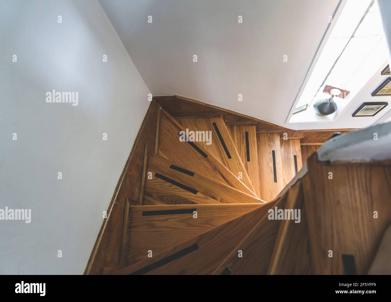 Top view of the wooden staircase. Vintage looking wooden steps inside ...