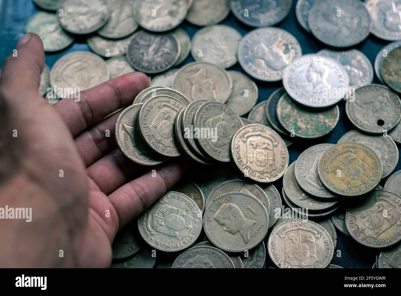 Old, outdated and non-tender Philippine currency bills and coins being ...