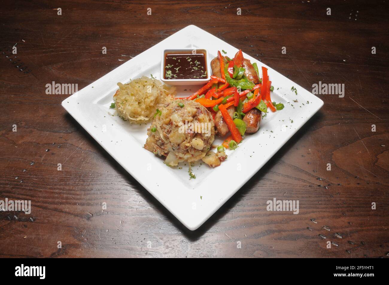 Delicious German cuisine known as a bratwurst platter Stock Photo - Alamy