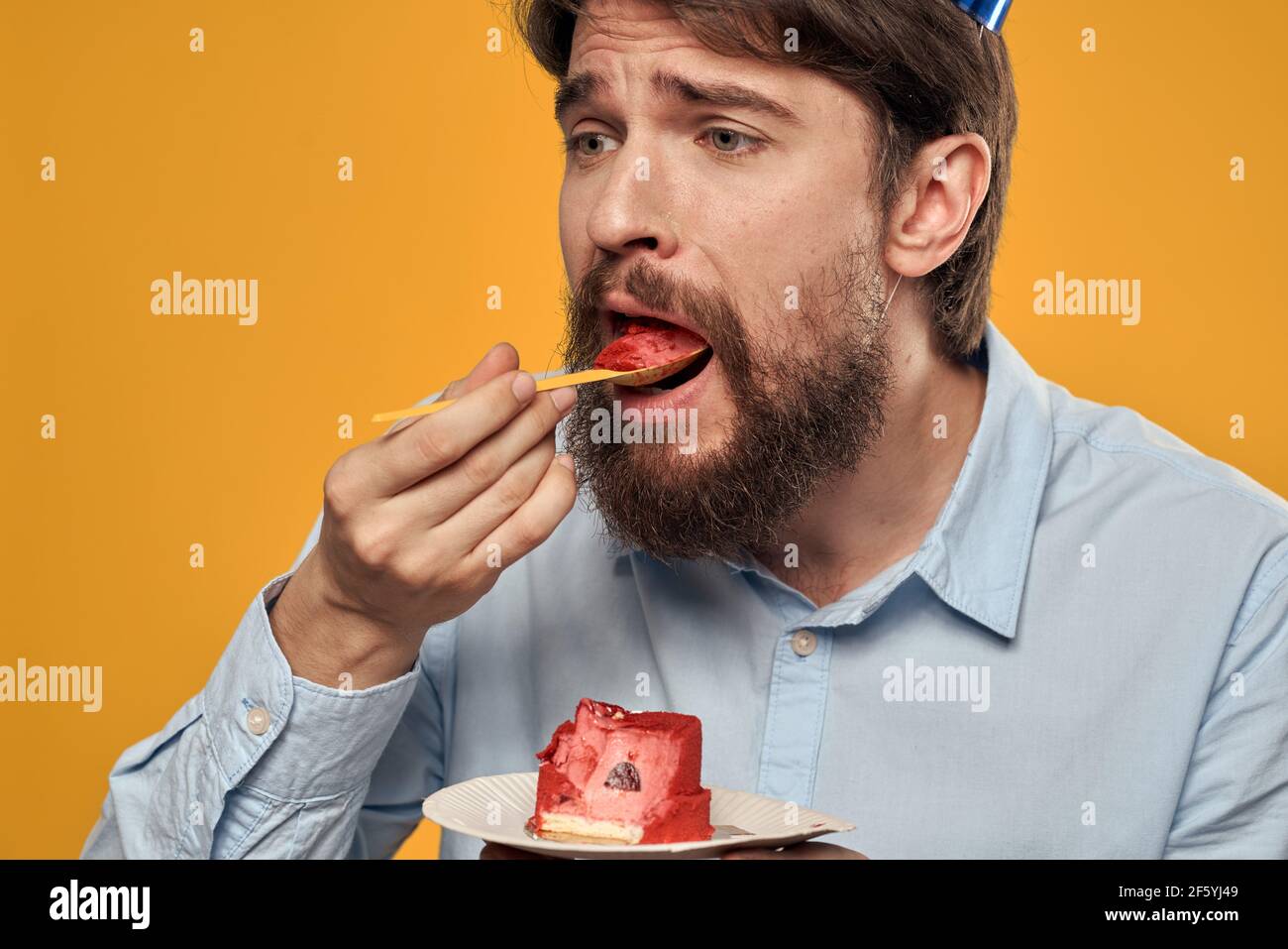 birthday cake man yellow background party candle Stock Photo - Alamy