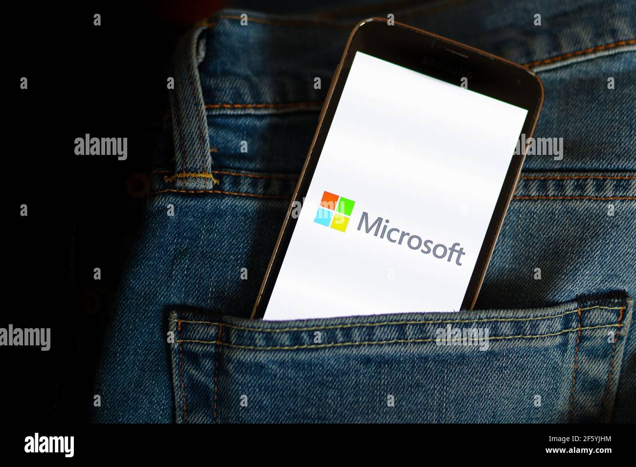 In this photo illustration, a Microsoft logo seen displayed on a ...