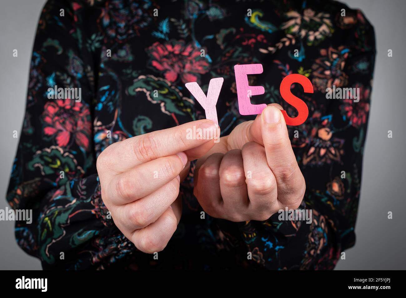 YES. Colorful wooden alphabet letters in a woman's hand Stock Photo - Alamy