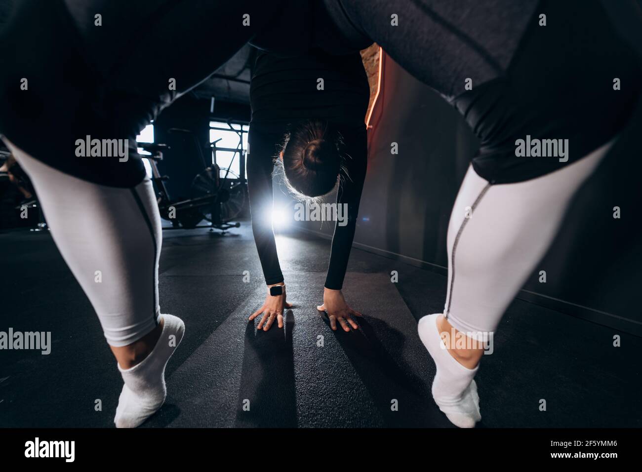 Slim athletic woman doing exercise bridge at gym Stock Photo - Alamy