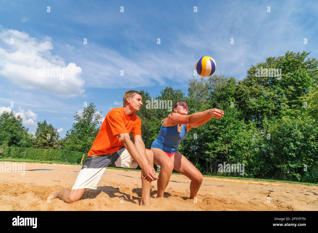 Intensive game on beachvolleyball court, fighting spirit to save the ...