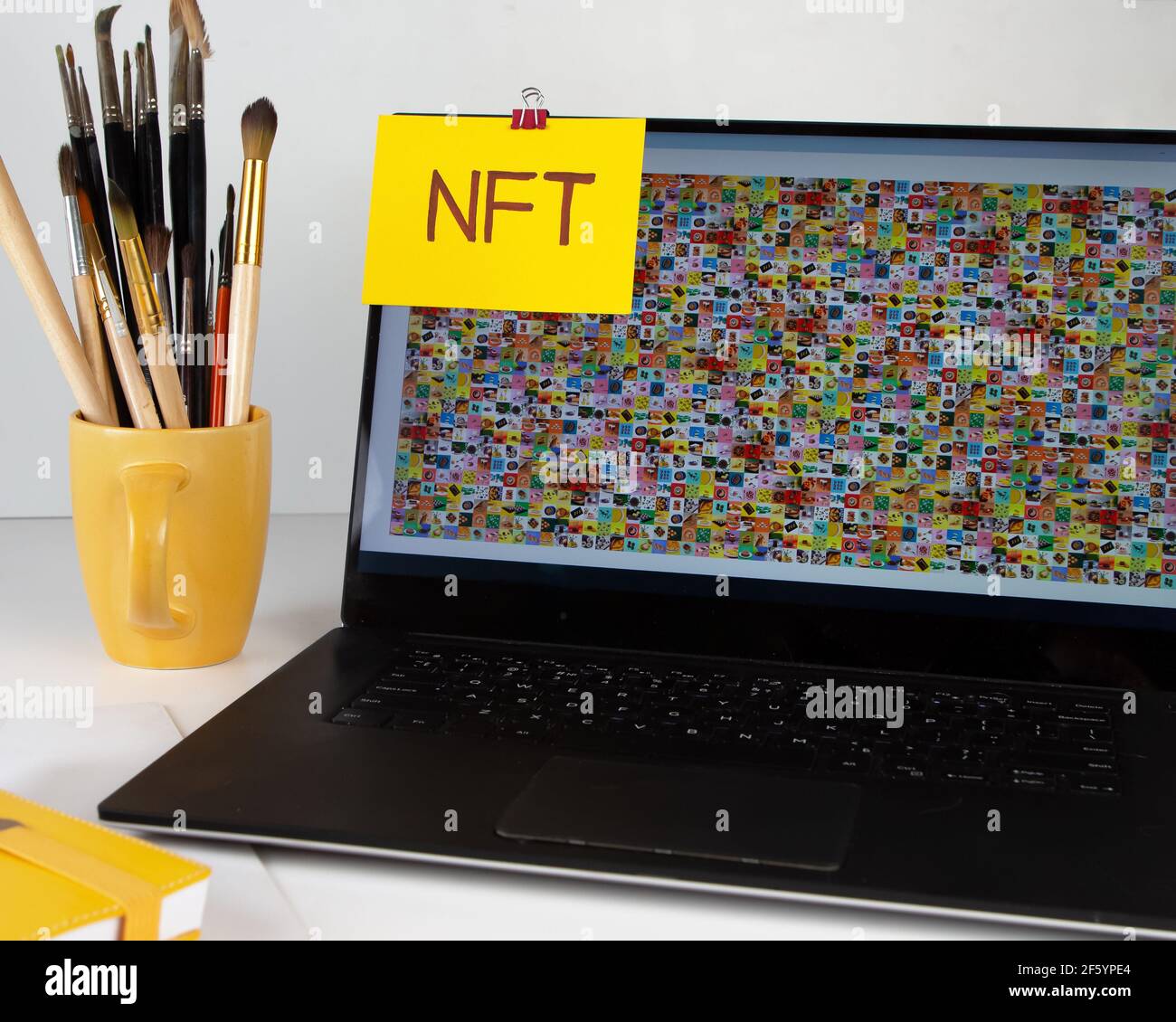 Kiev, Ukraine, March 2021.Laptopop with Cryptoart photo collage. Unique ...