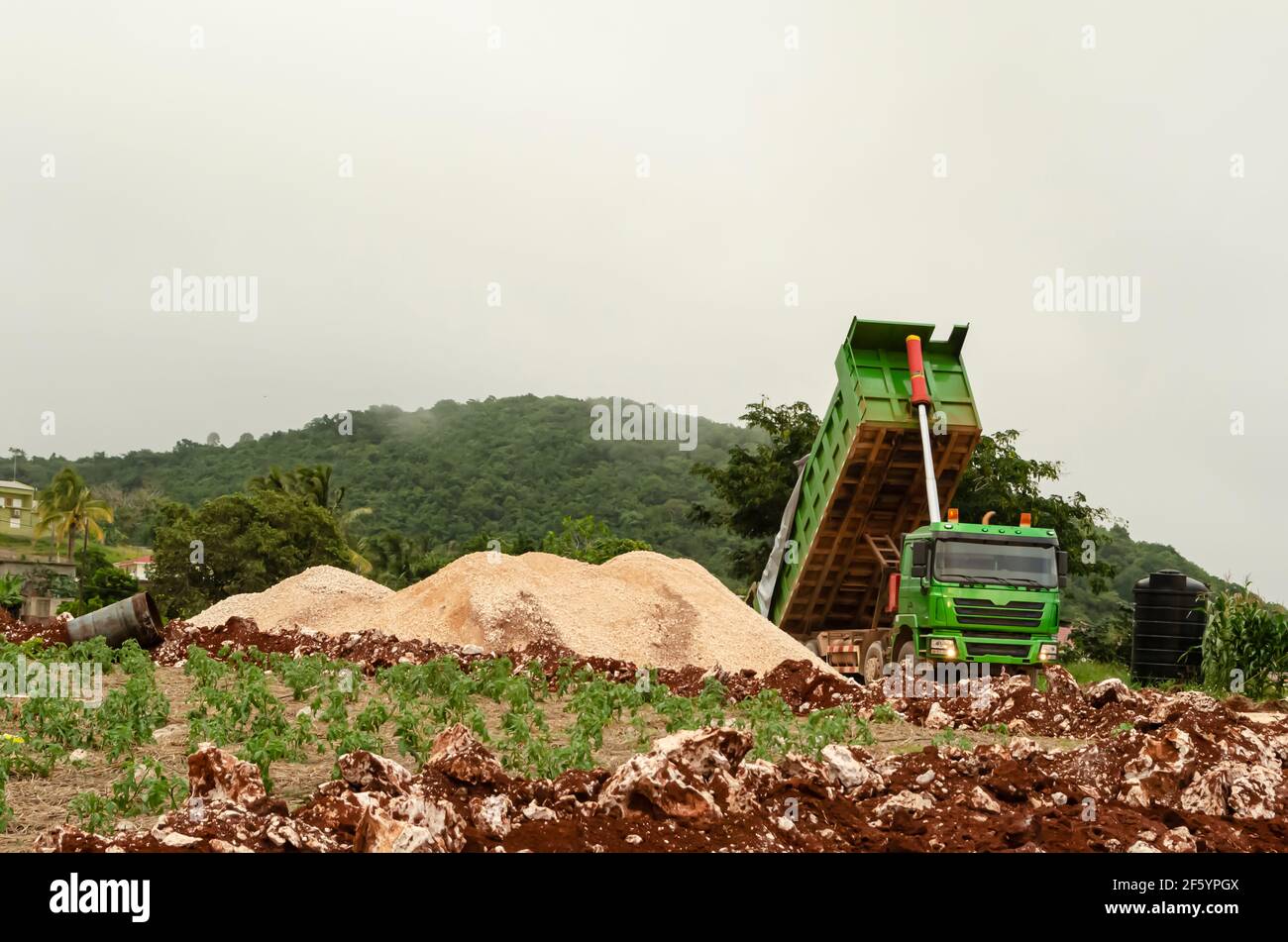 Truck Dumping Material On Work Site Stock Photo - Alamy