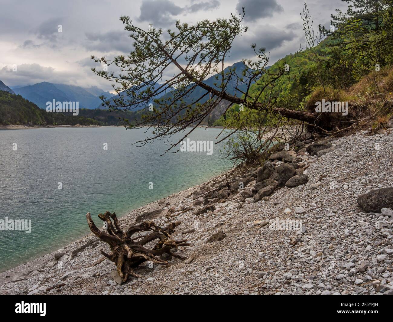 Alpine lake near Meduno, Italy and cloudy sky Stock Photo - Alamy