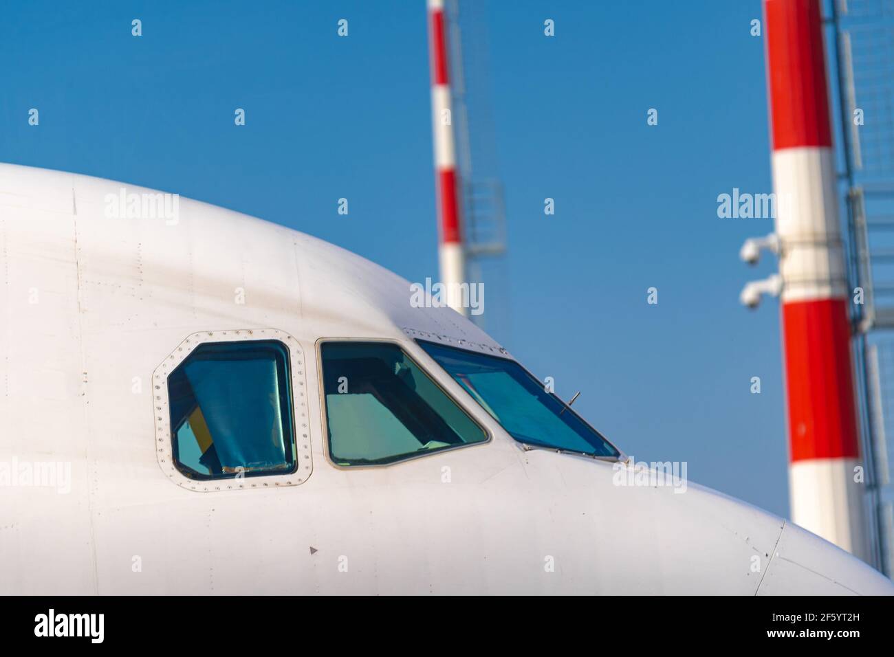 Cockpit of big passenger airliner on runway close up Stock Photo - Alamy