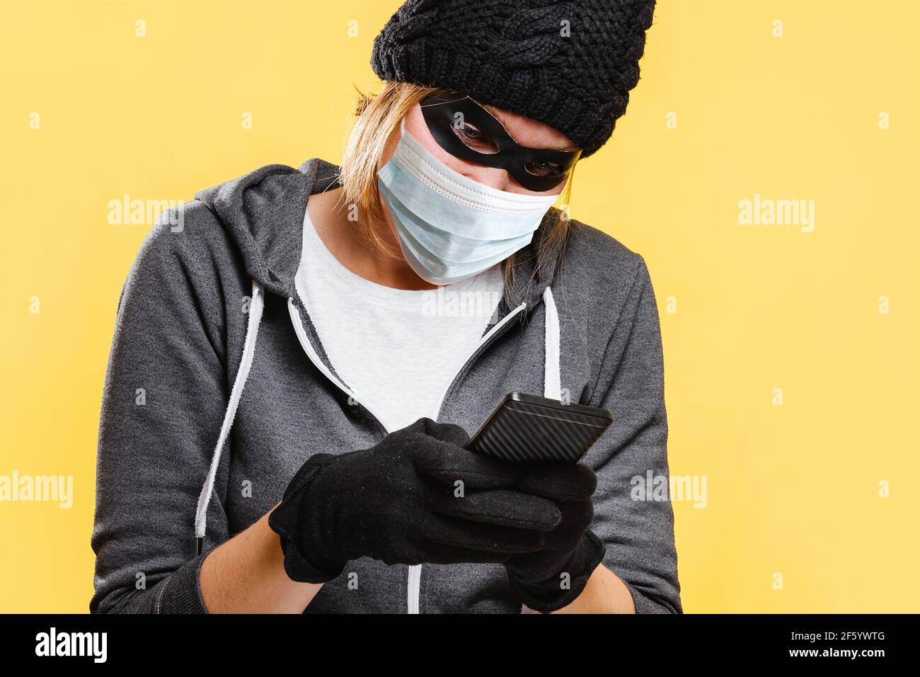Female hacker in black mask hi-res stock photography and images - Alamy