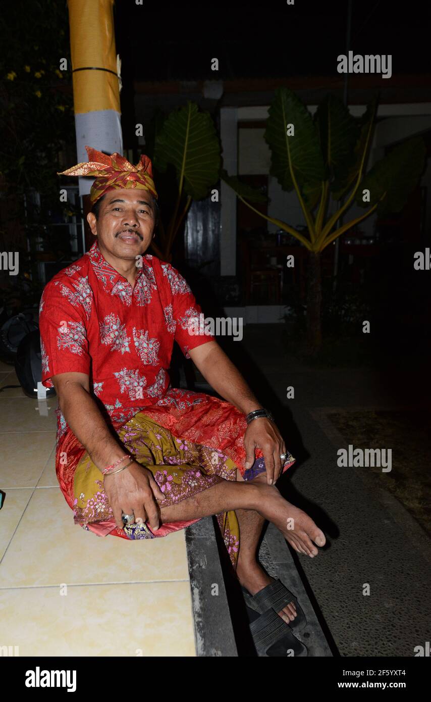 A Balinese man wearing traditional cloth Stock Photo - Alamy
