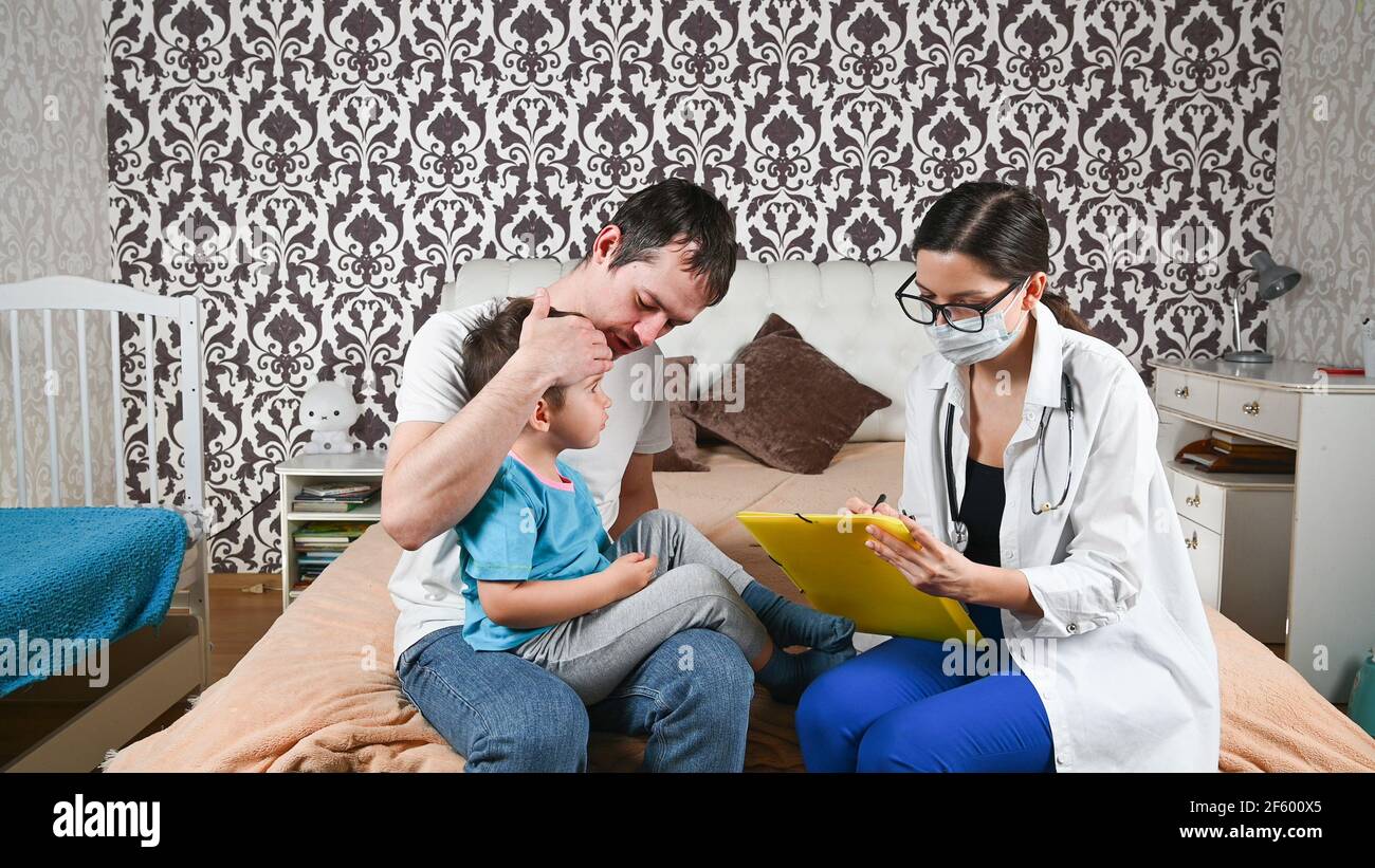 Father with a child and a doctor. High quality photo Stock Photo - Alamy