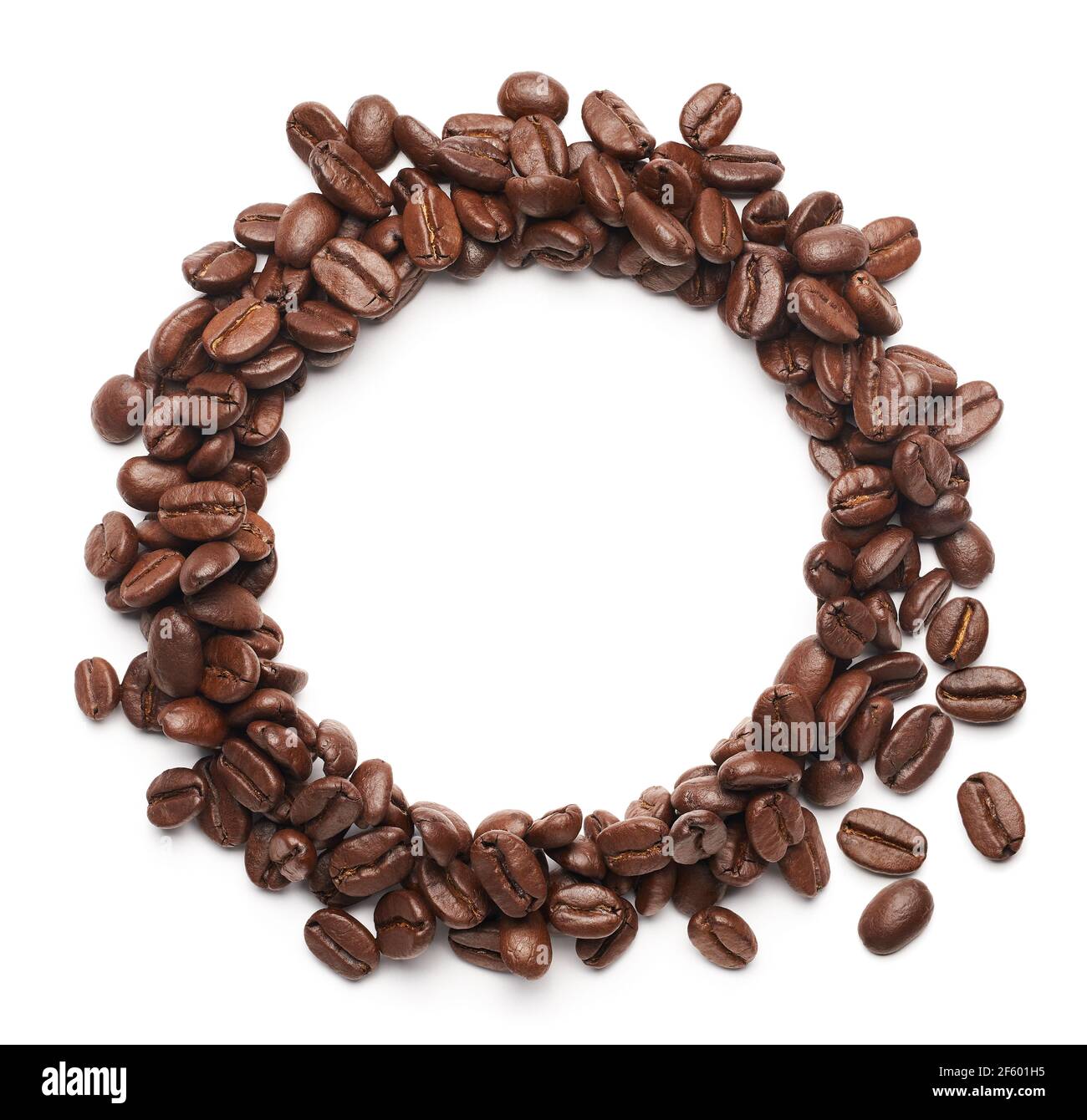 Coffee beans forming a ring shape for copy space over white background ...