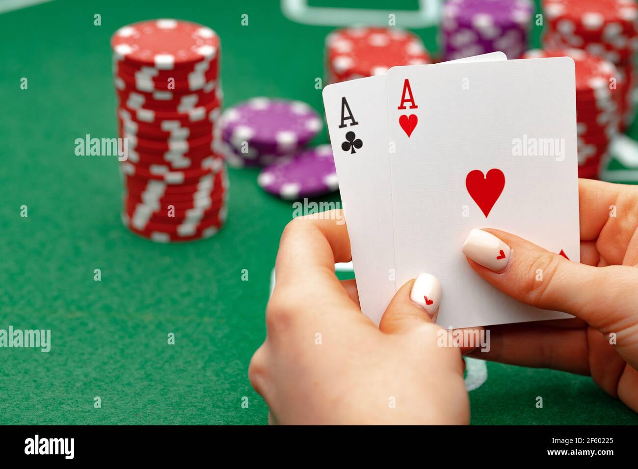 Woman playing poker hand hi-res stock photography and images - Alamy