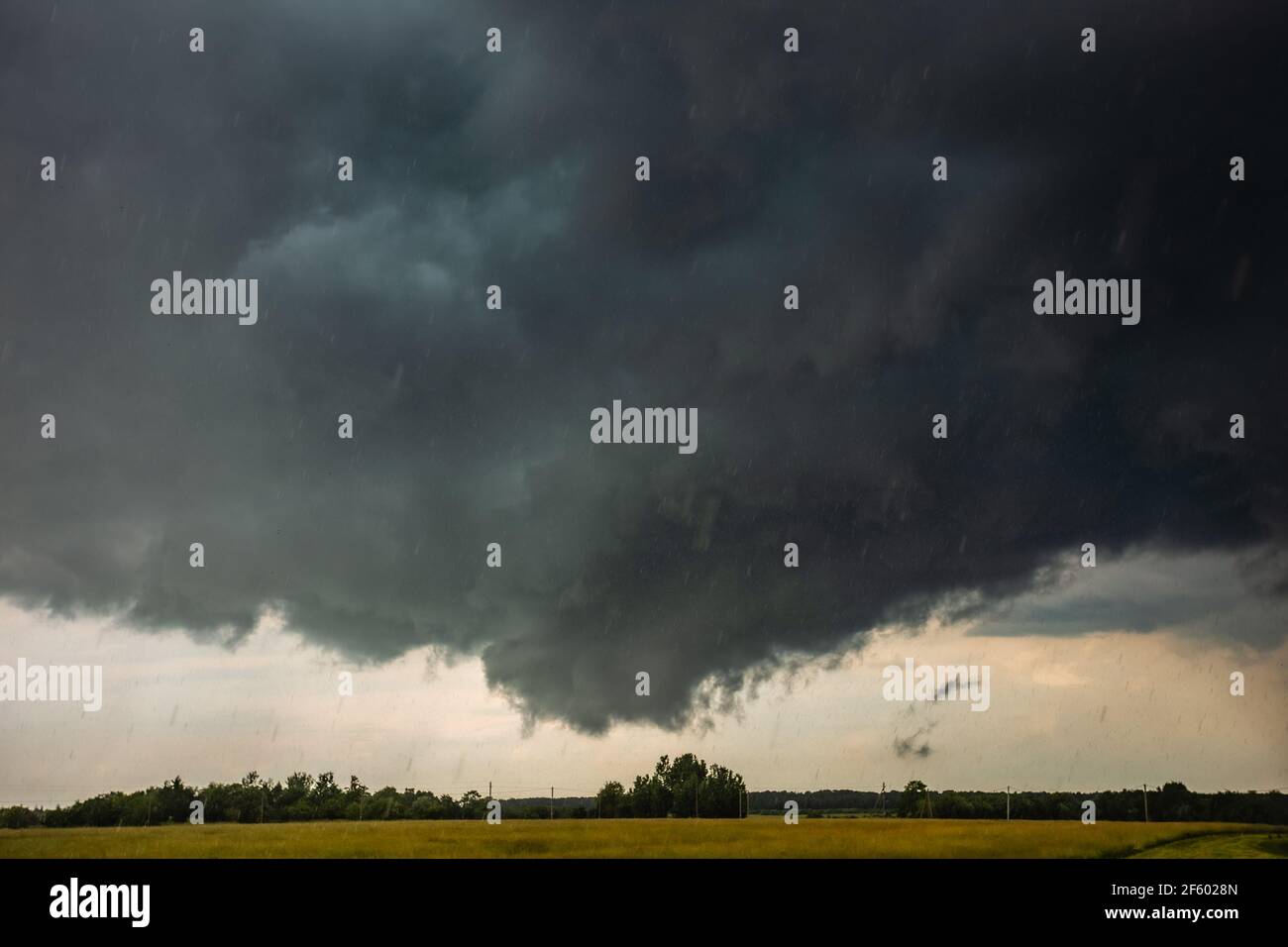 Supercell storm clouds with wall cloud and intense rain Stock Photo - Alamy