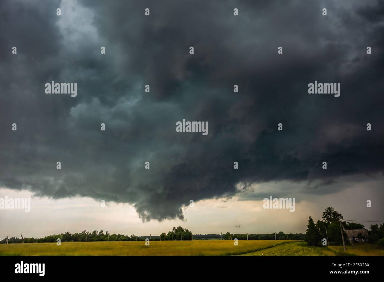 Supercell storm clouds with wall cloud and intense rain Stock Photo - Alamy