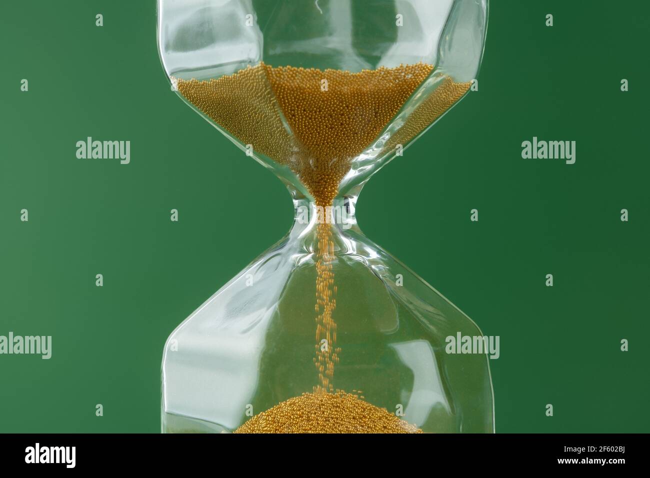 Close up hourglass on golden hi-res stock photography and images - Alamy