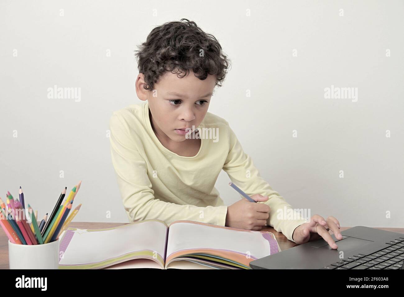 little boy learning at school on white background stock photo Stock ...