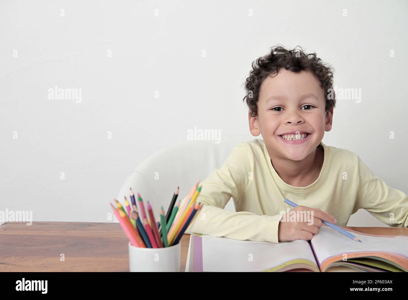 little boy learning at school on white background stock photo Stock ...