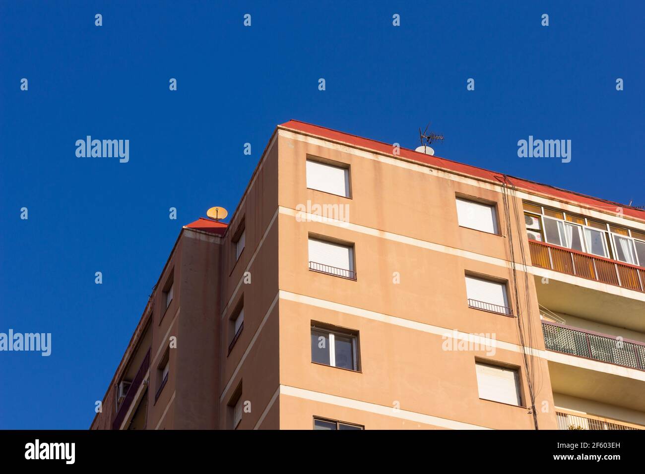 Cornices of buildings against a background of blue sky; angles formed ...