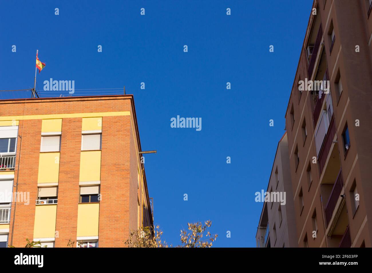 Cornices of buildings against a background of blue sky; angles formed ...