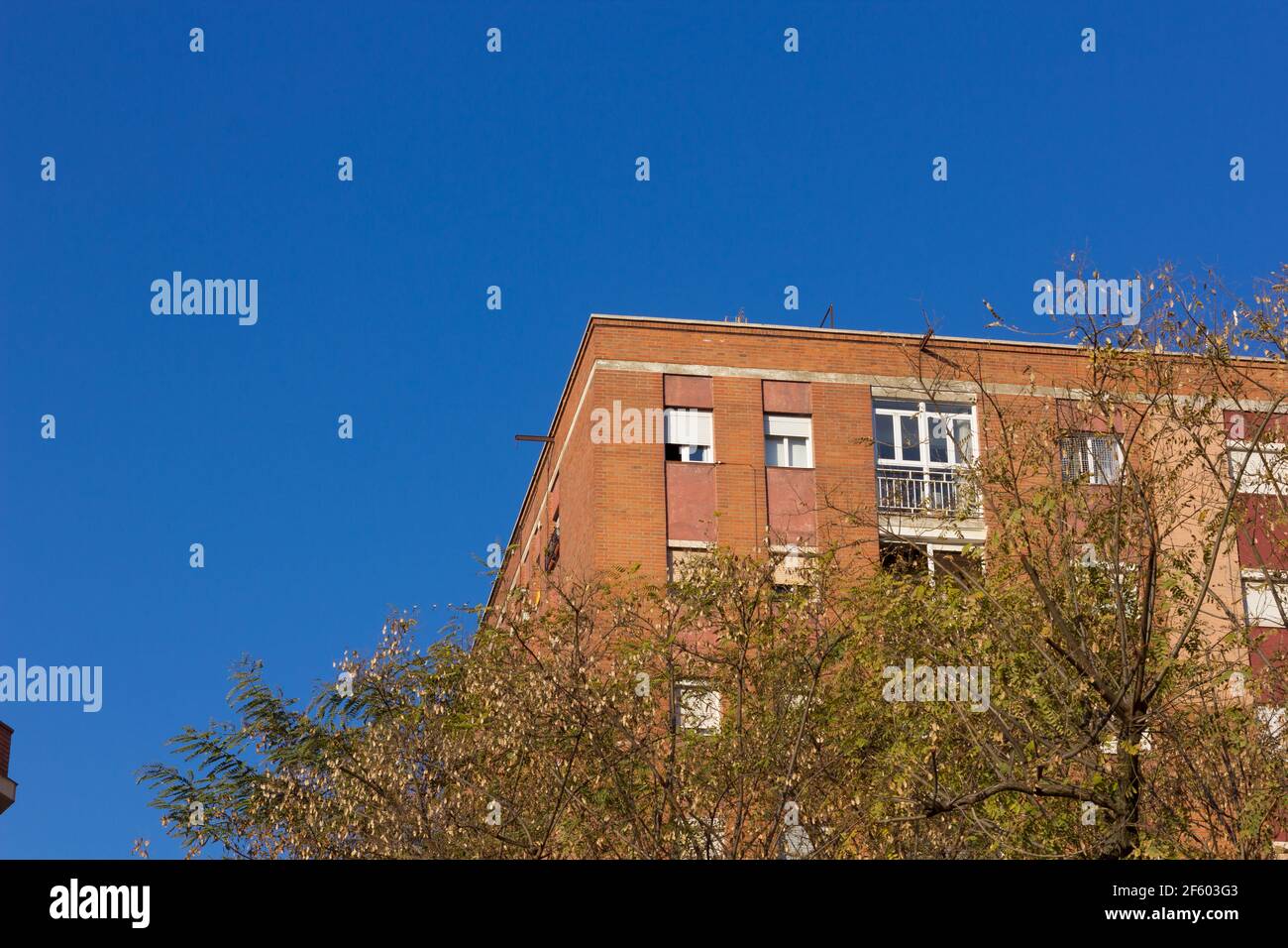 Cornices of buildings against a background of blue sky; angles formed ...