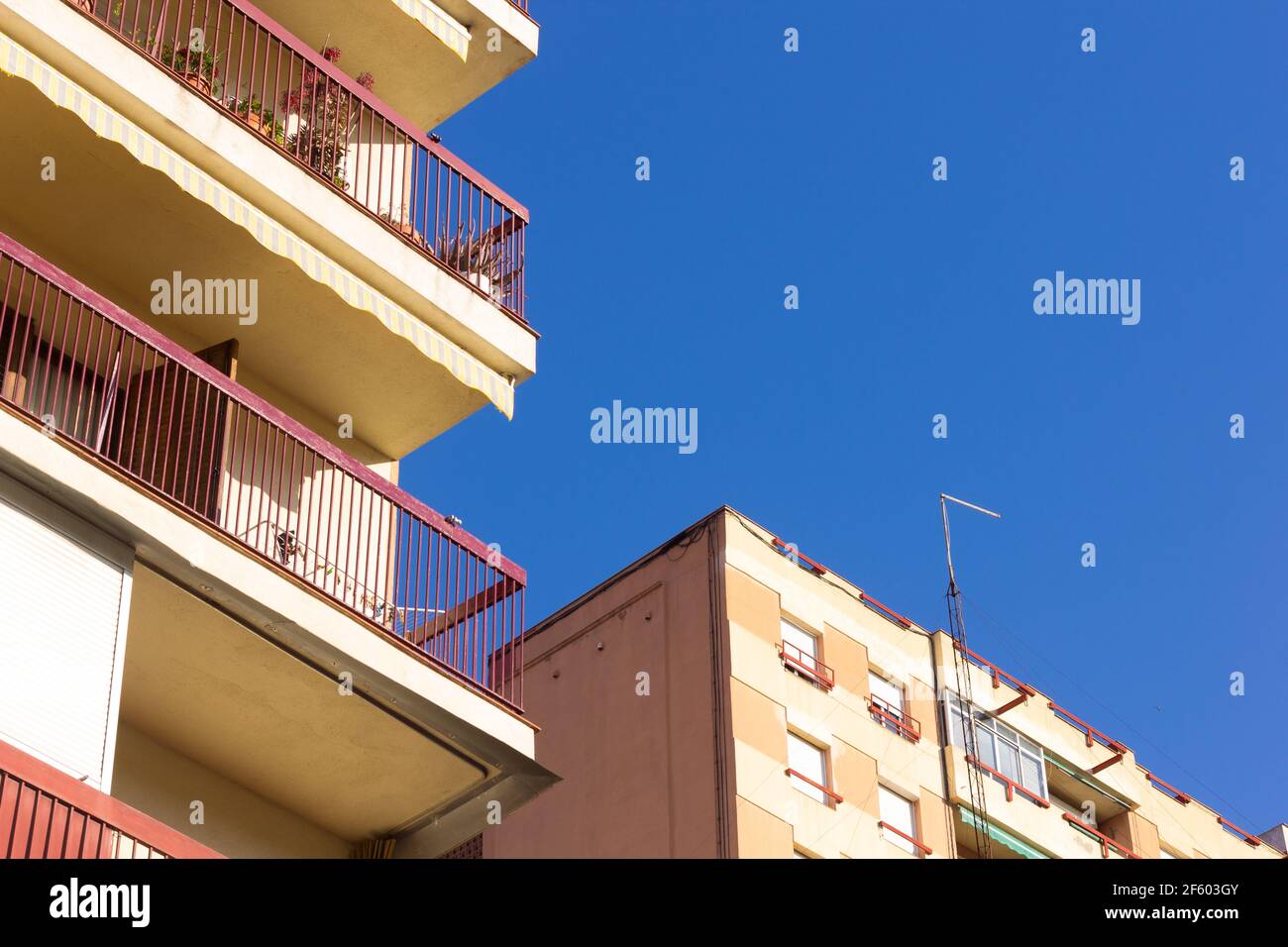 Cornices of buildings against a background of blue sky; angles formed ...