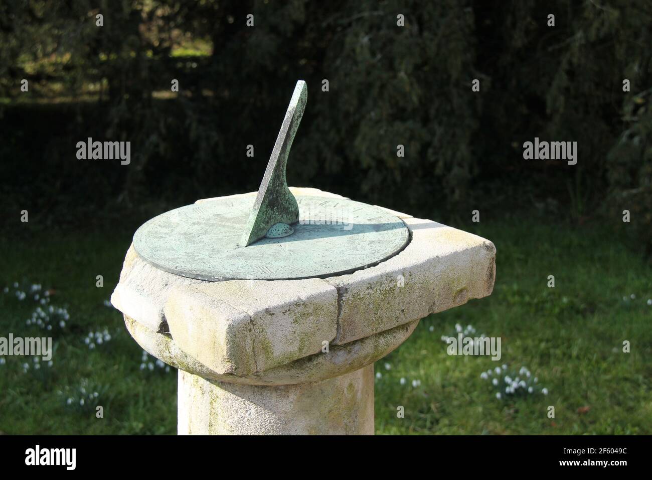 A Traditional Metal Sun Dial Standing on a Stone Plinth Stock Photo - Alamy