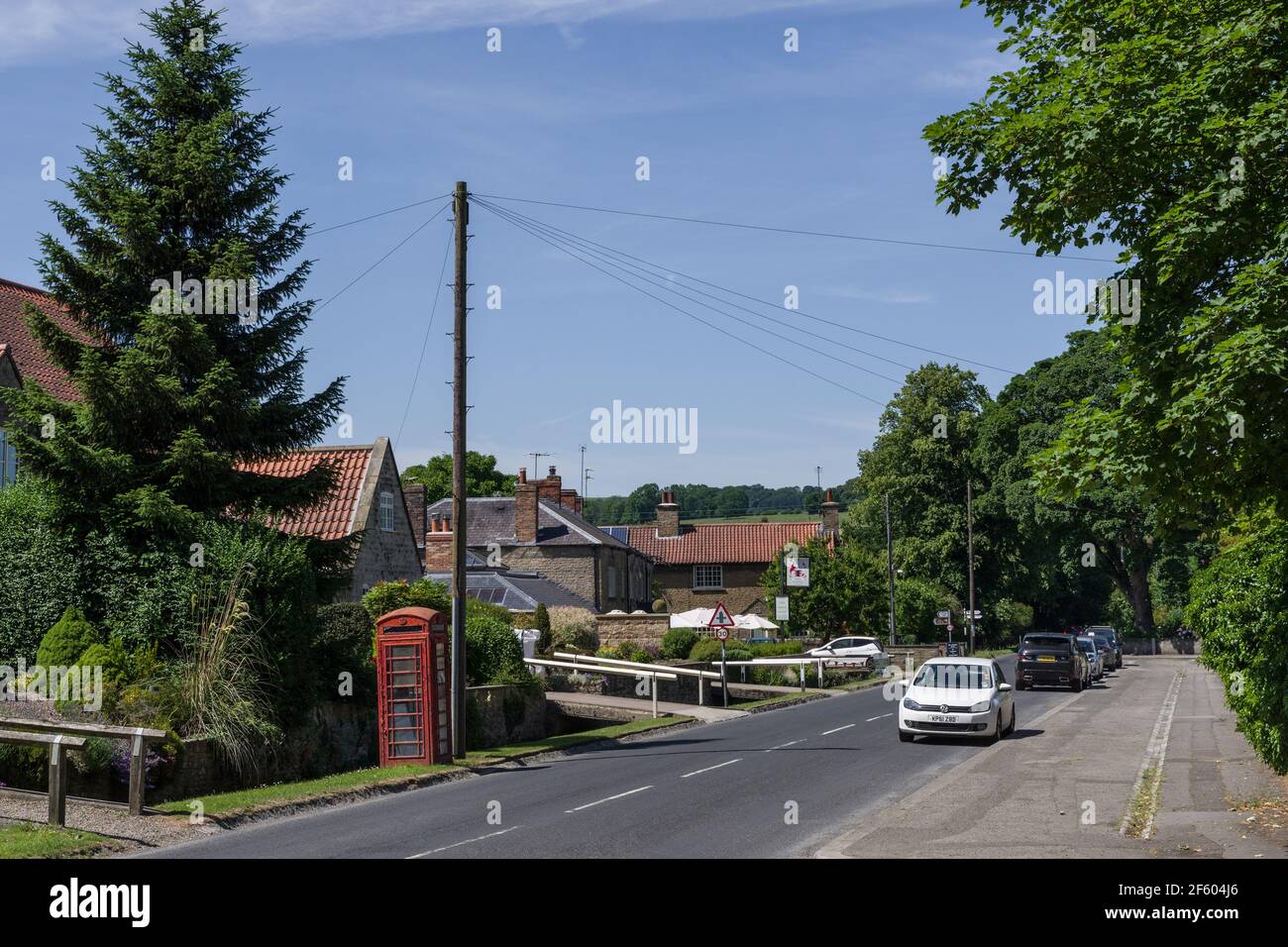 Street scene in summer in the pretty village of Gilling East, Yorkshire ...