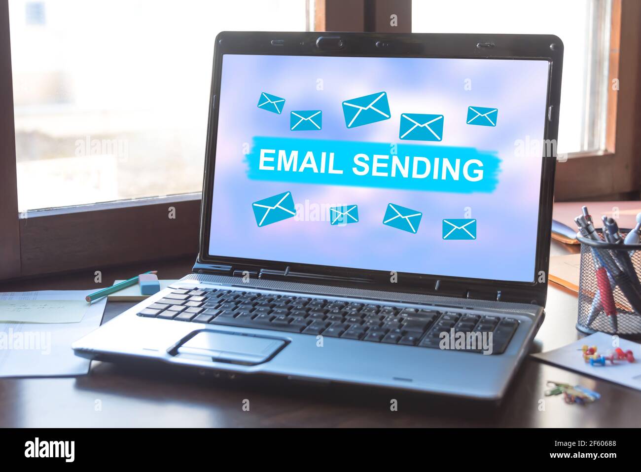 Laptop screen displaying an email sending concept Stock Photo - Alamy