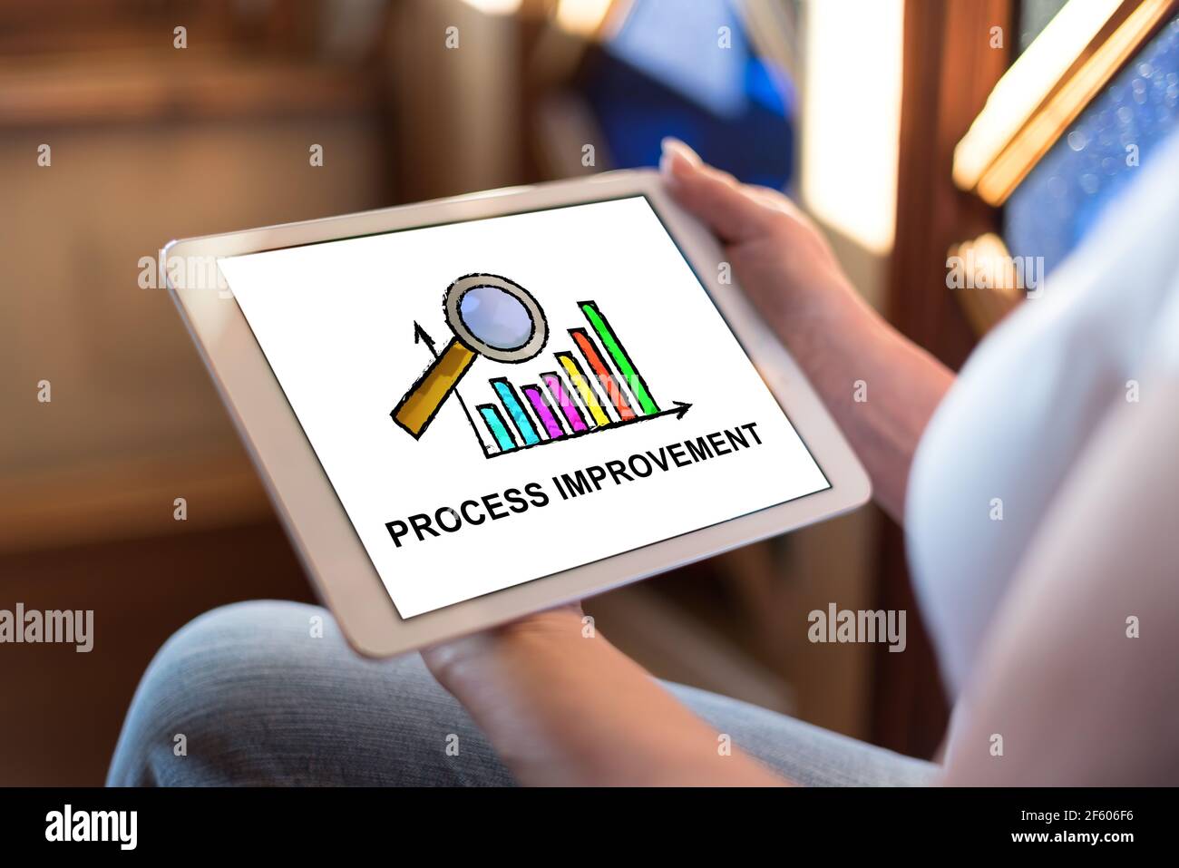 Woman holding a tablet showing process improvement concept Stock Photo ...
